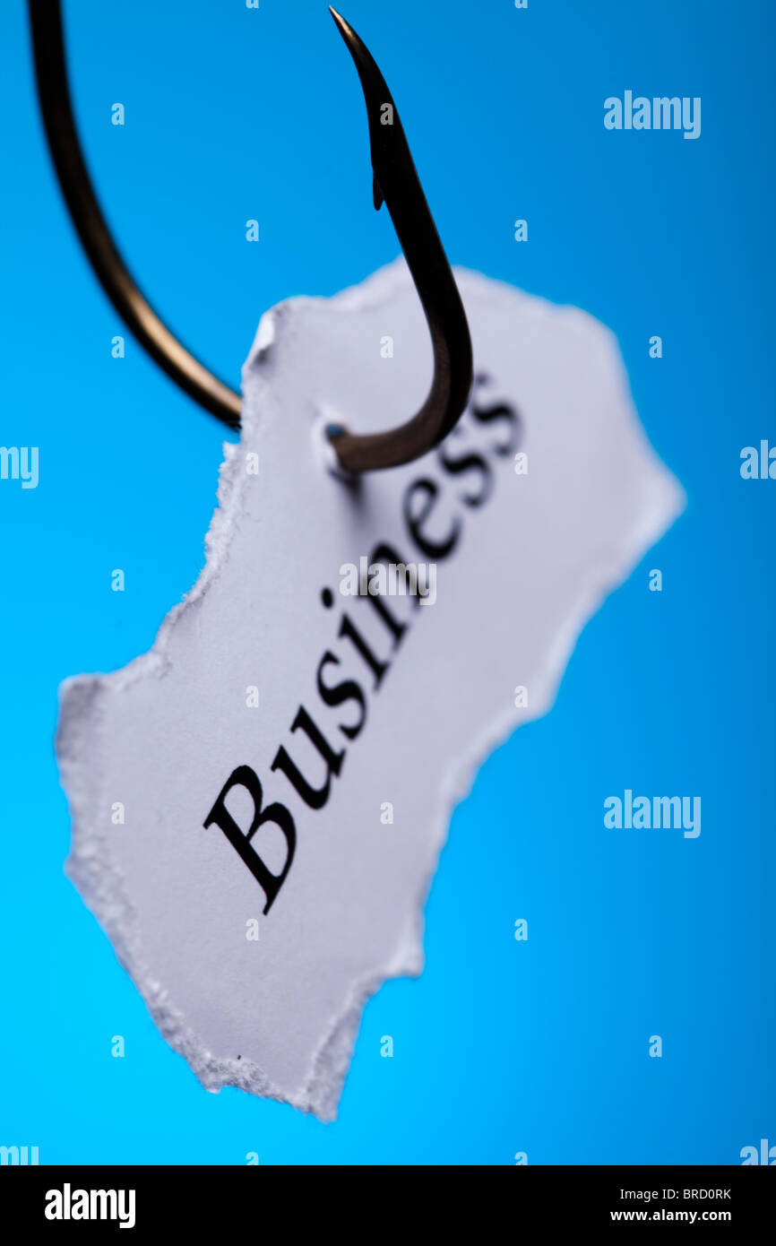 Business on peace of paper pierced in hook Stock Photo - Alamy