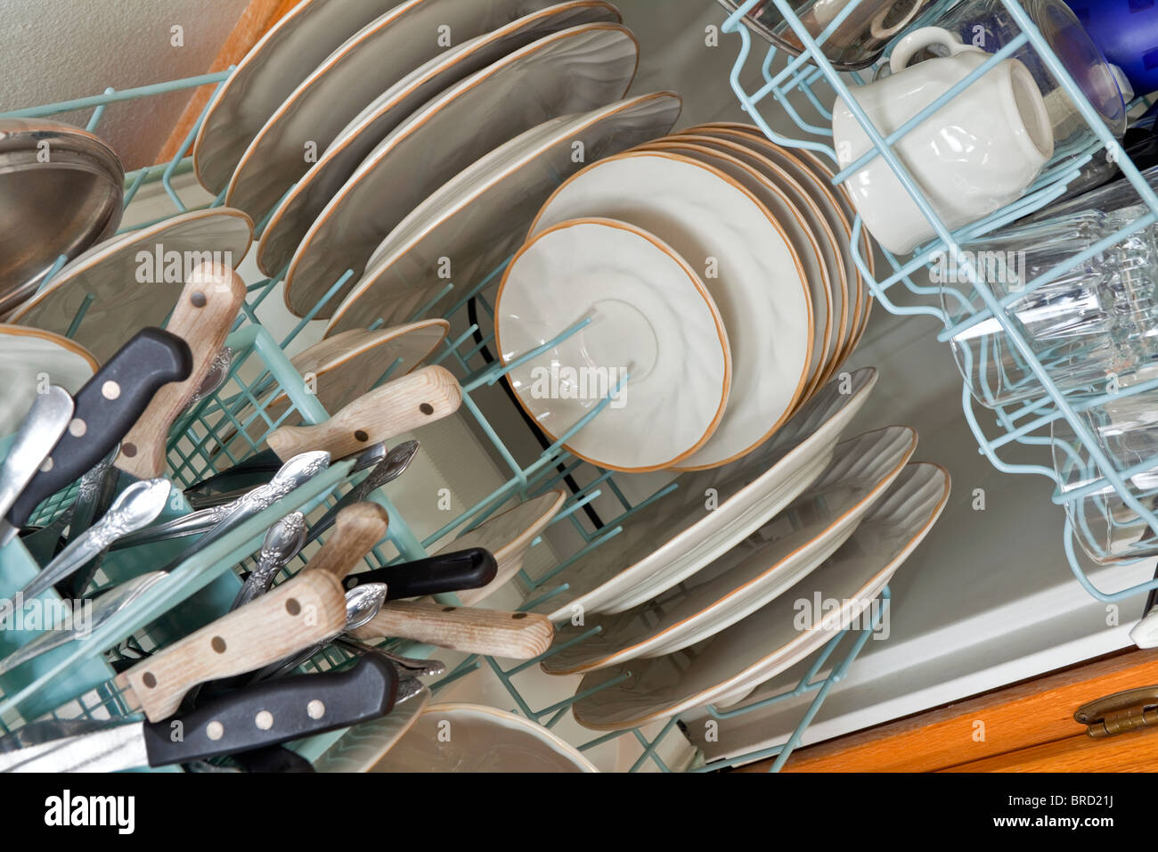 Fully loaded dish washer ready to party Stock Photo - Alamy
