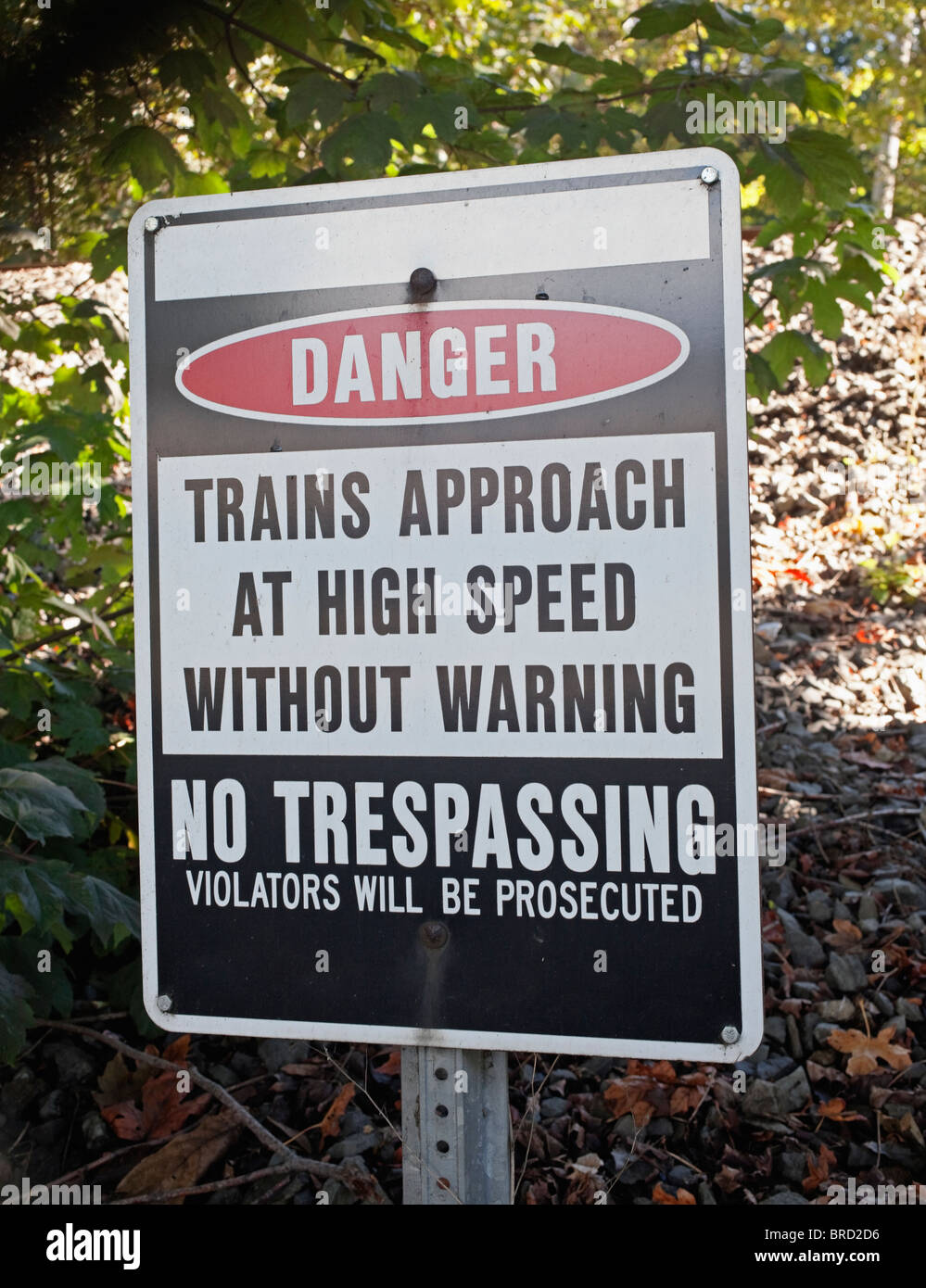 high speed train warning sign mounted in public park Stock Photo - Alamy