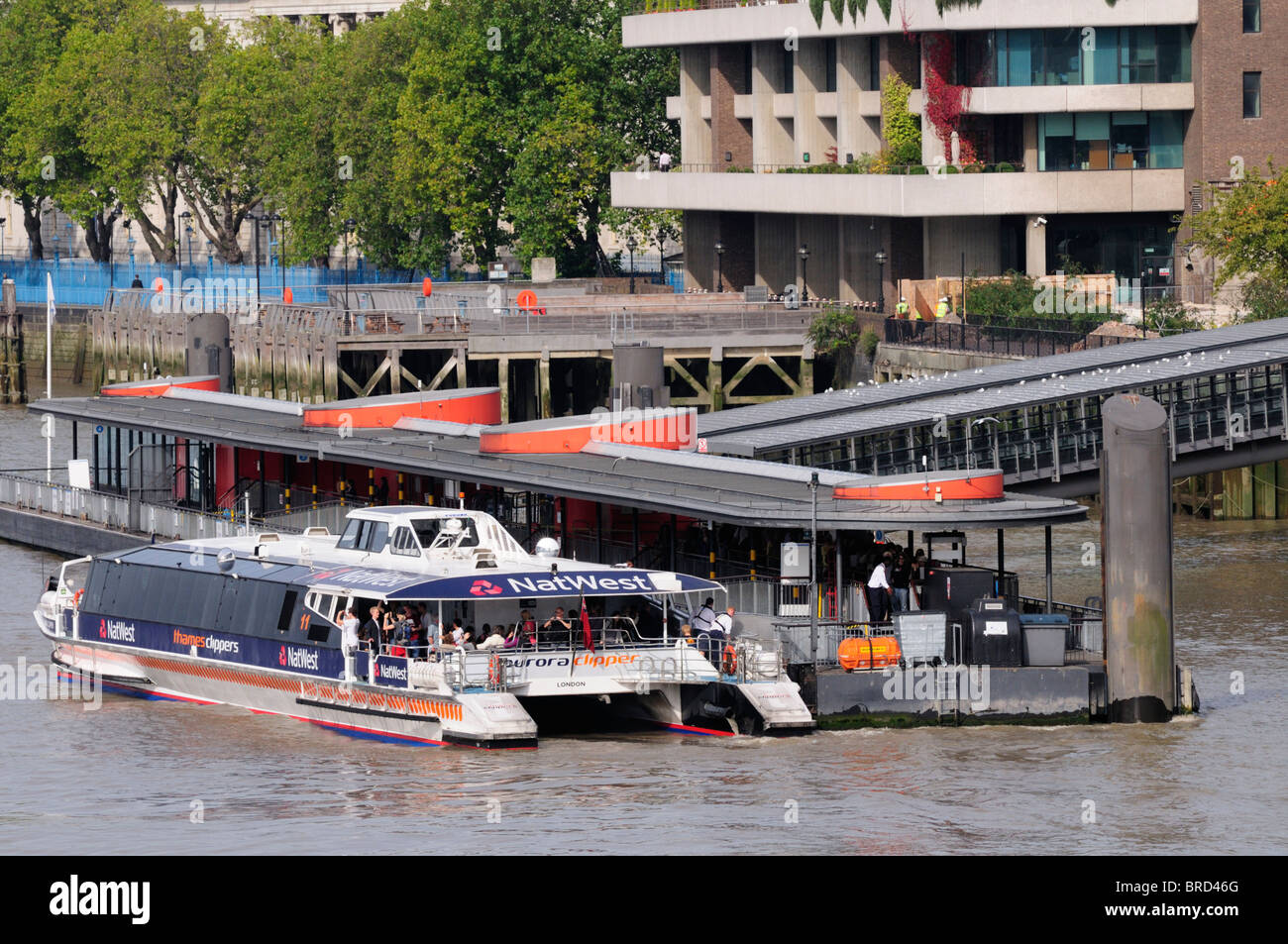 A Thames Clippers passenger ferry Riverbus at Tower Pier, London ...