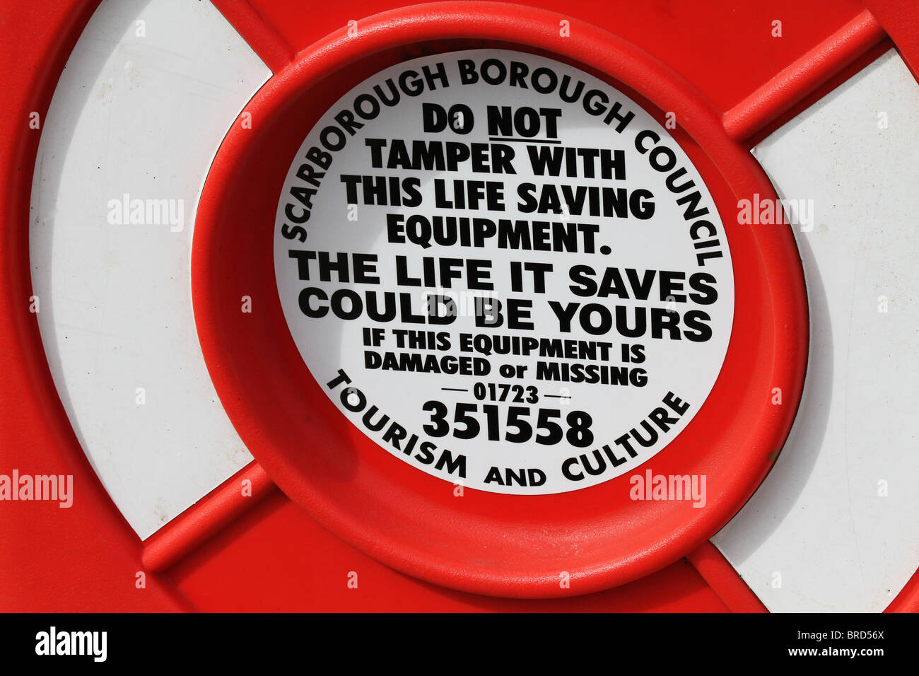 Center instruction and warning on life saving ring at waterside Stock ...