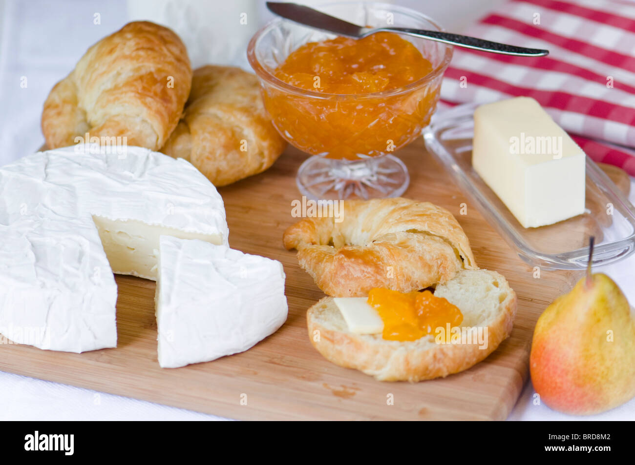 Breakfast with Camembert cheese, milk, and jam Stock Photo - Alamy