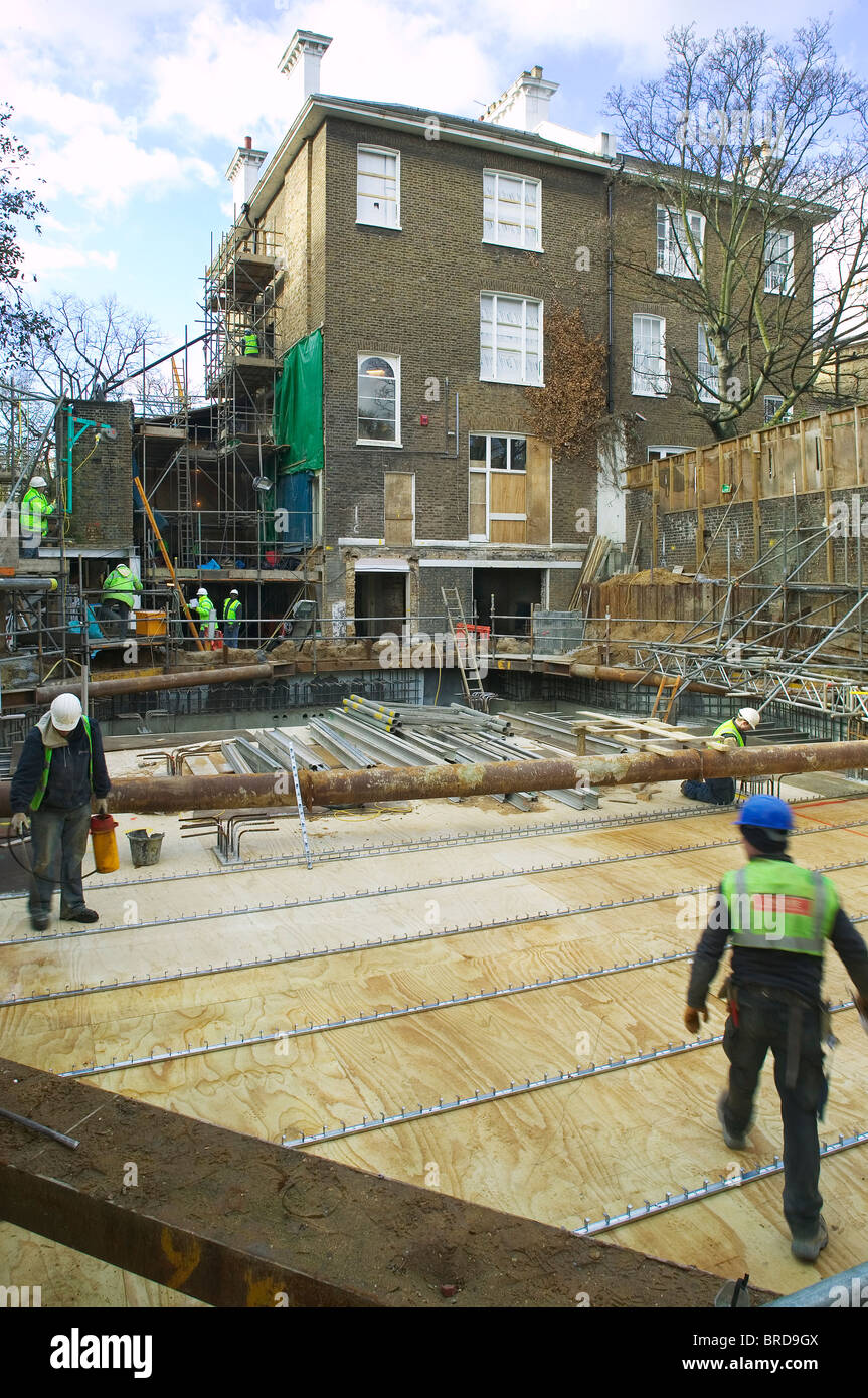 Workers on boards on residential building site Stock Photo - Alamy