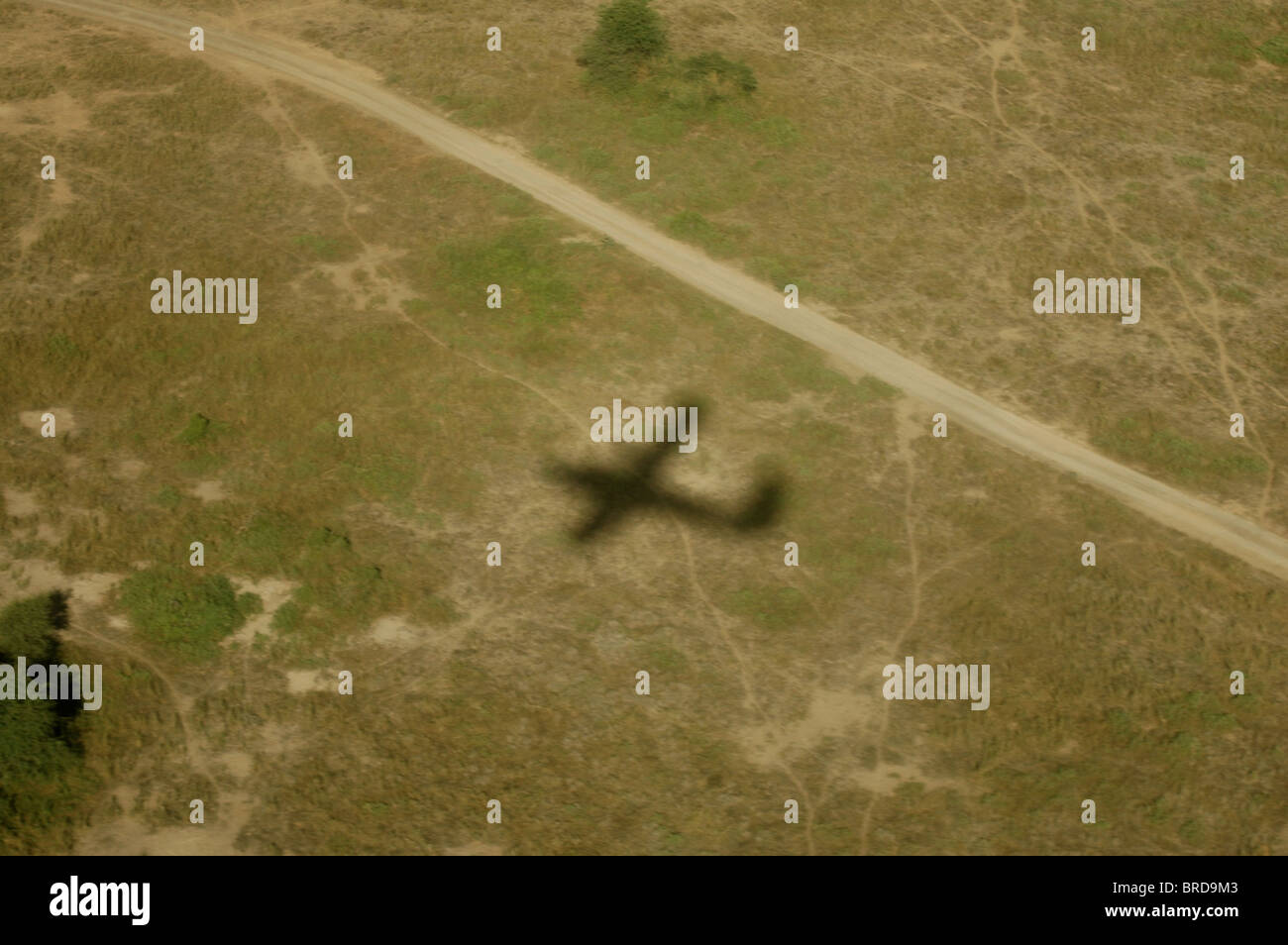 Shadow of plane in flight over African plains Stock Photo - Alamy