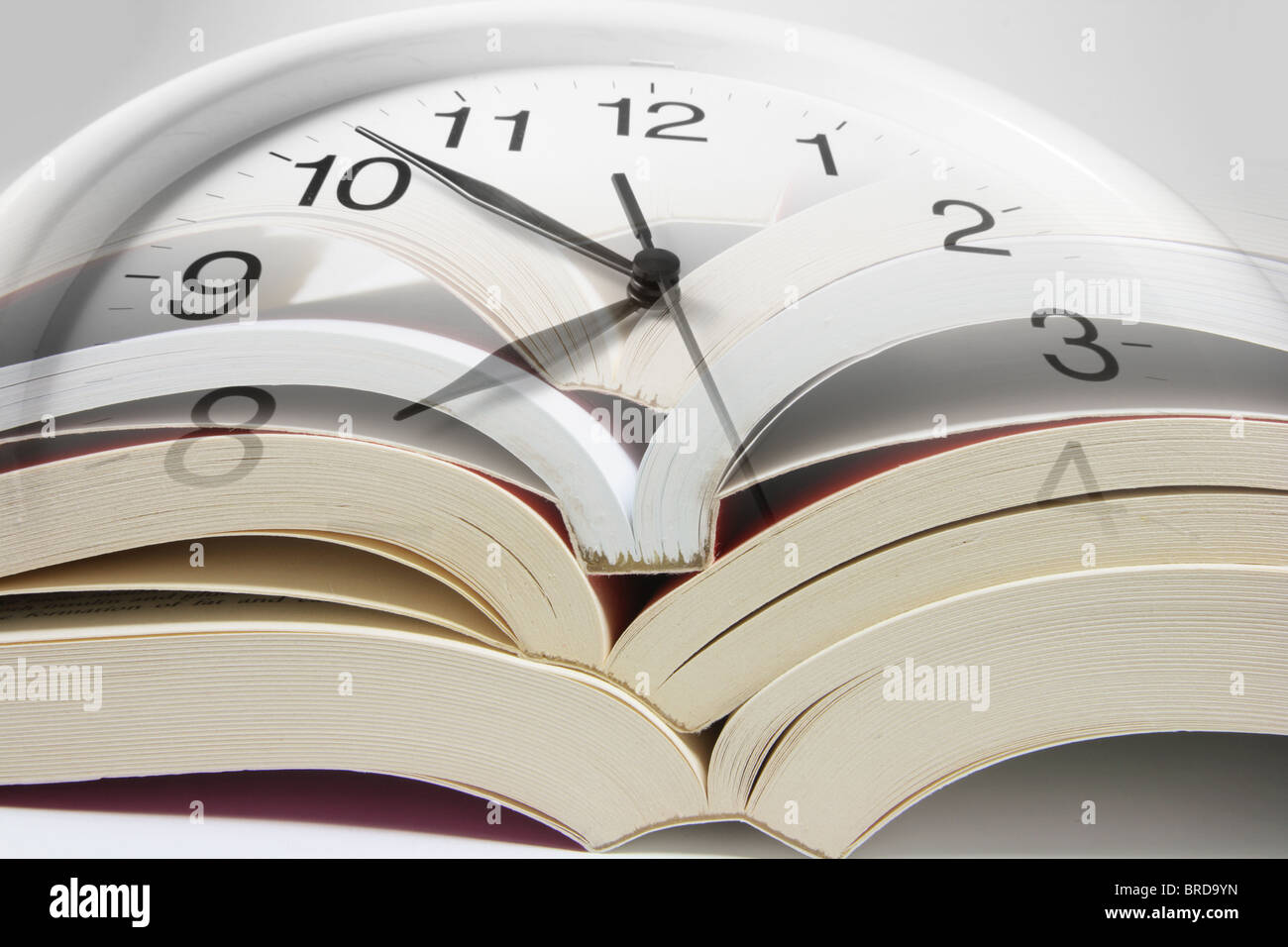 Books and Clock Stock Photo - Alamy
