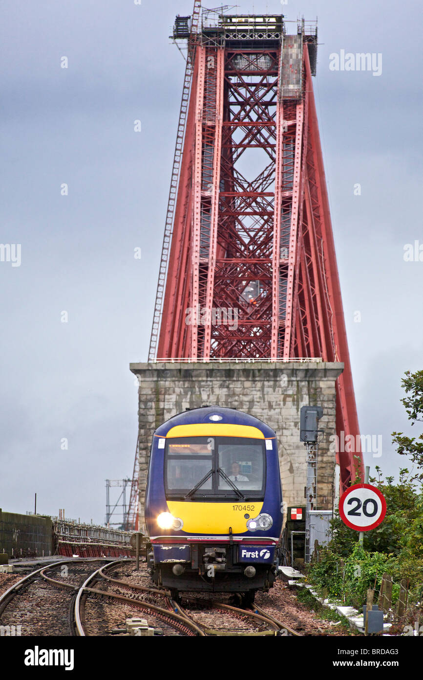 A commuter train crosses the Forth rail bridge in to North Queensferry ...