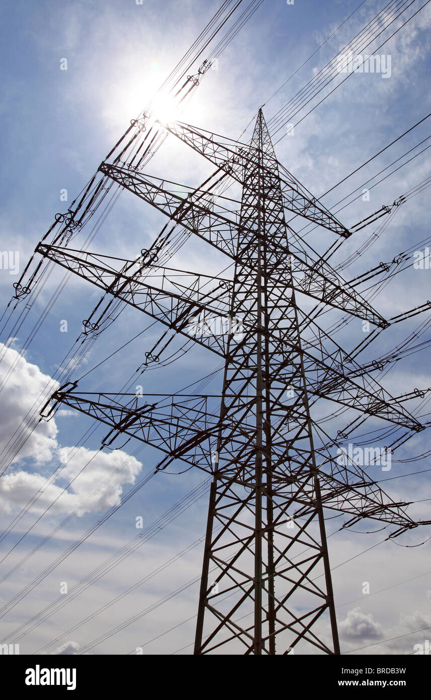 A huge power pole in front of a shiny blue sky Stock Photo - Alamy
