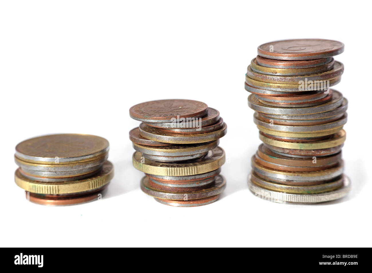 Coins in ascending piles hi-res stock photography and images - Alamy