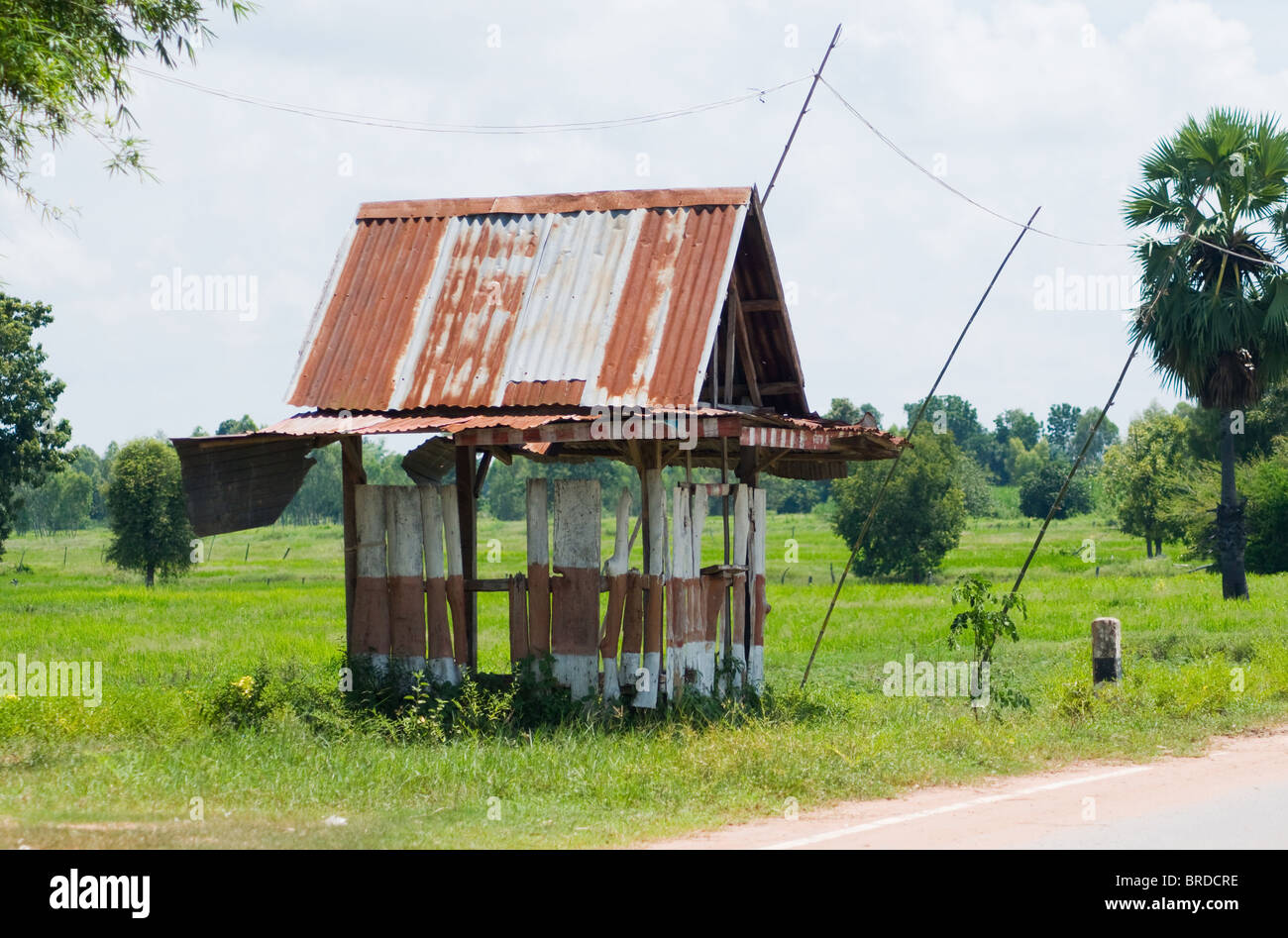 Primitive bus stop shelter in rural Nakhon Ratchasima, Thailand. Rice ...