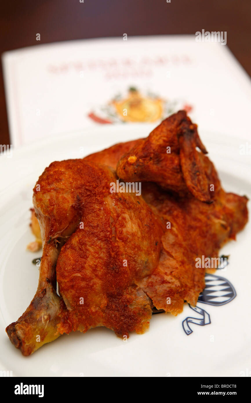 A Hendl (half of a grilled chicken) is served at the 2010 Munich ...