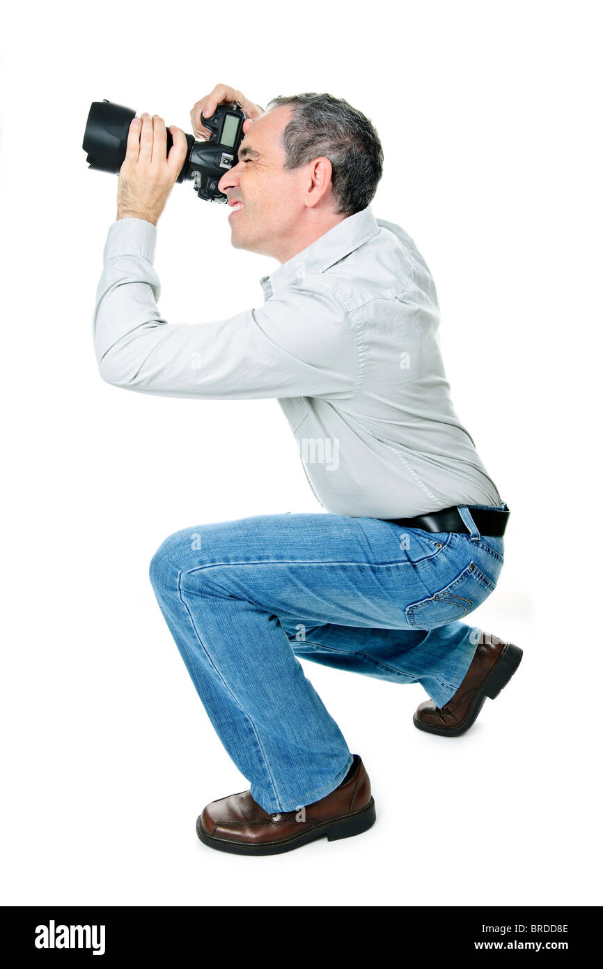 Portrait of male photographer with camera isolated on white background ...