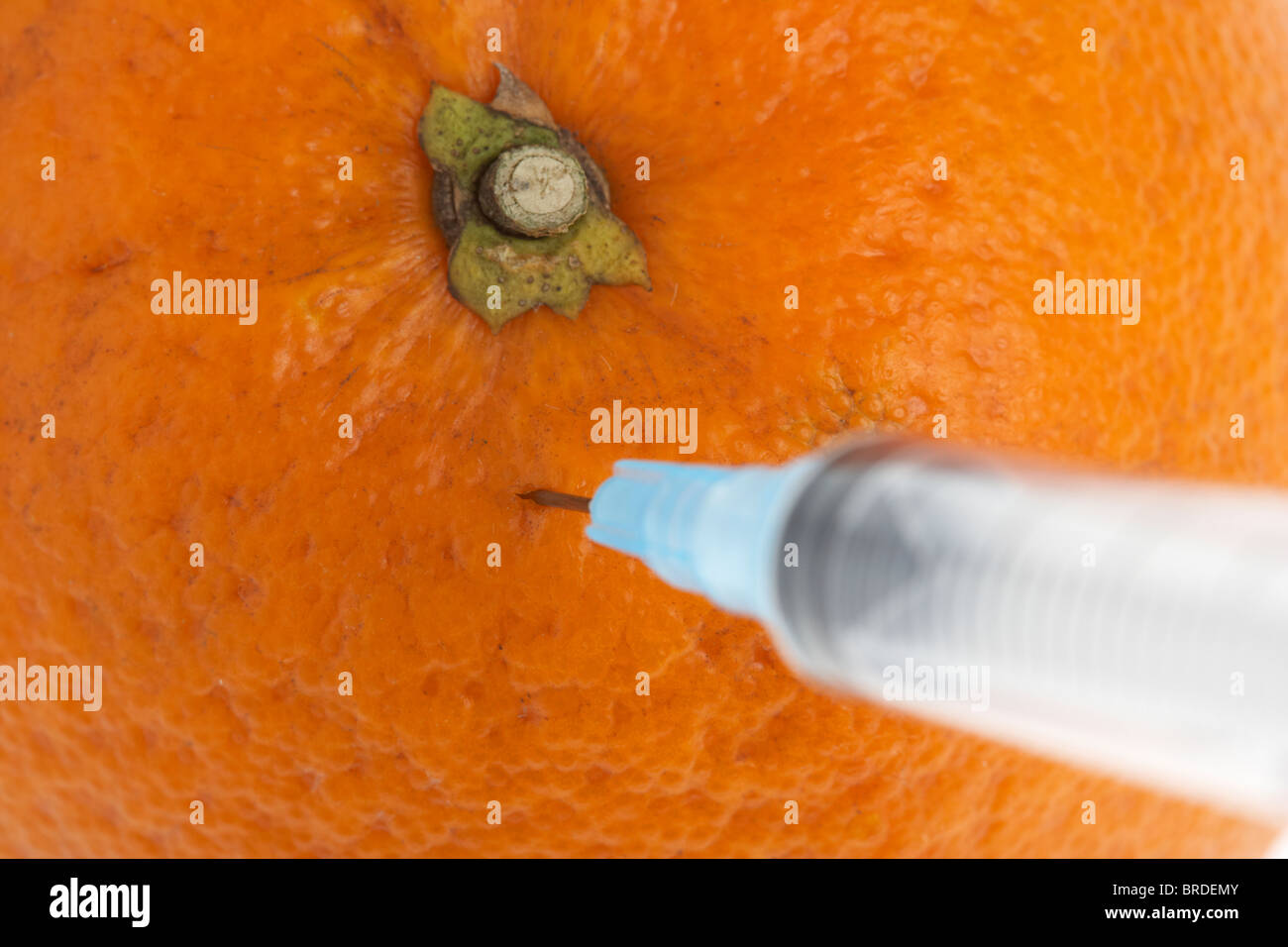 Syringe injecting orange fruit hi-res stock photography and images - Alamy