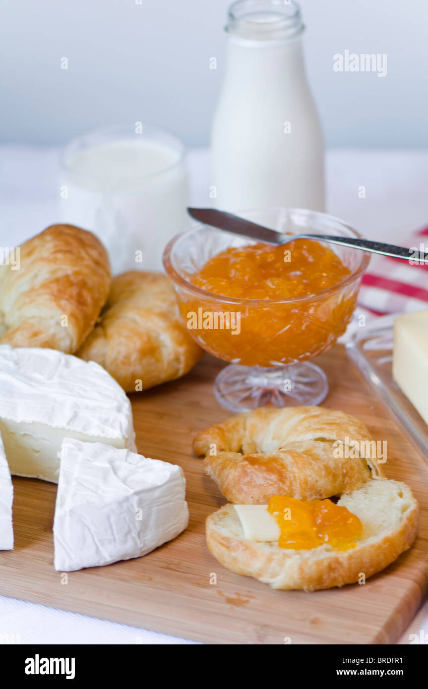 Breakfast with croissant, Camembert cheese, milk, and apricot jam Stock ...