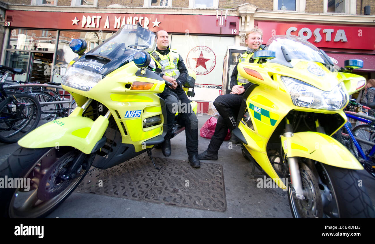 NHS ambulance motorcycle riders parked up outside Liverpool Street ...