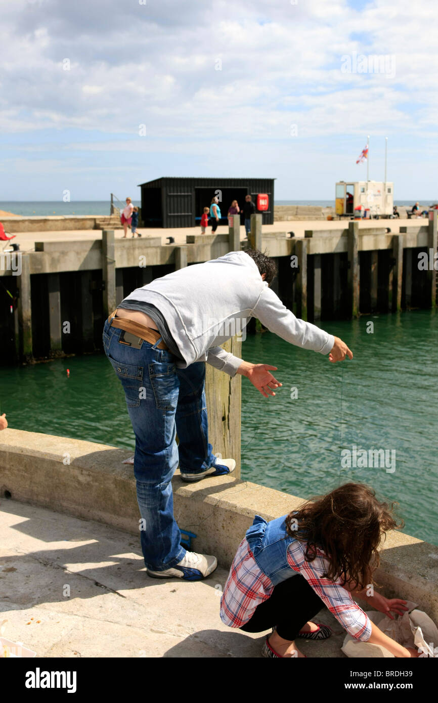 Children catching fish rod hi-res stock photography and images - Alamy