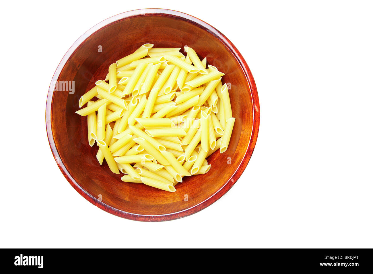 Close-up photo of the wooden cup with macaroni on a white background ...