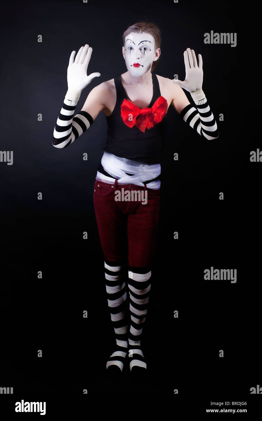 Mime with a big red bow on a black background Stock Photo - Alamy