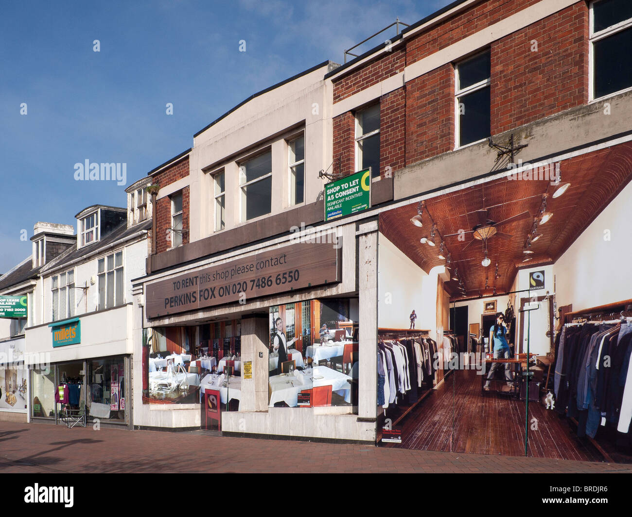 Empty shops decorated by the Local Council using large photographs to ...