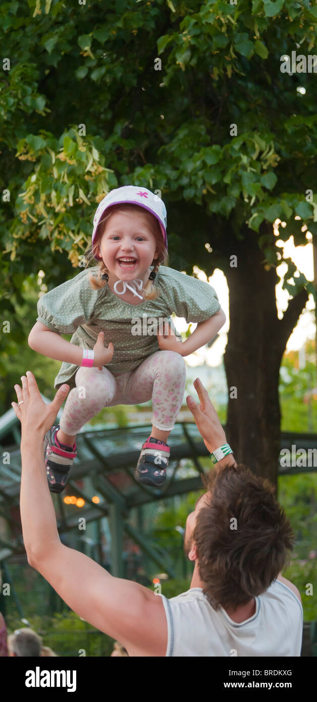 Child in the air. Happy family situation Stock Photo - Alamy