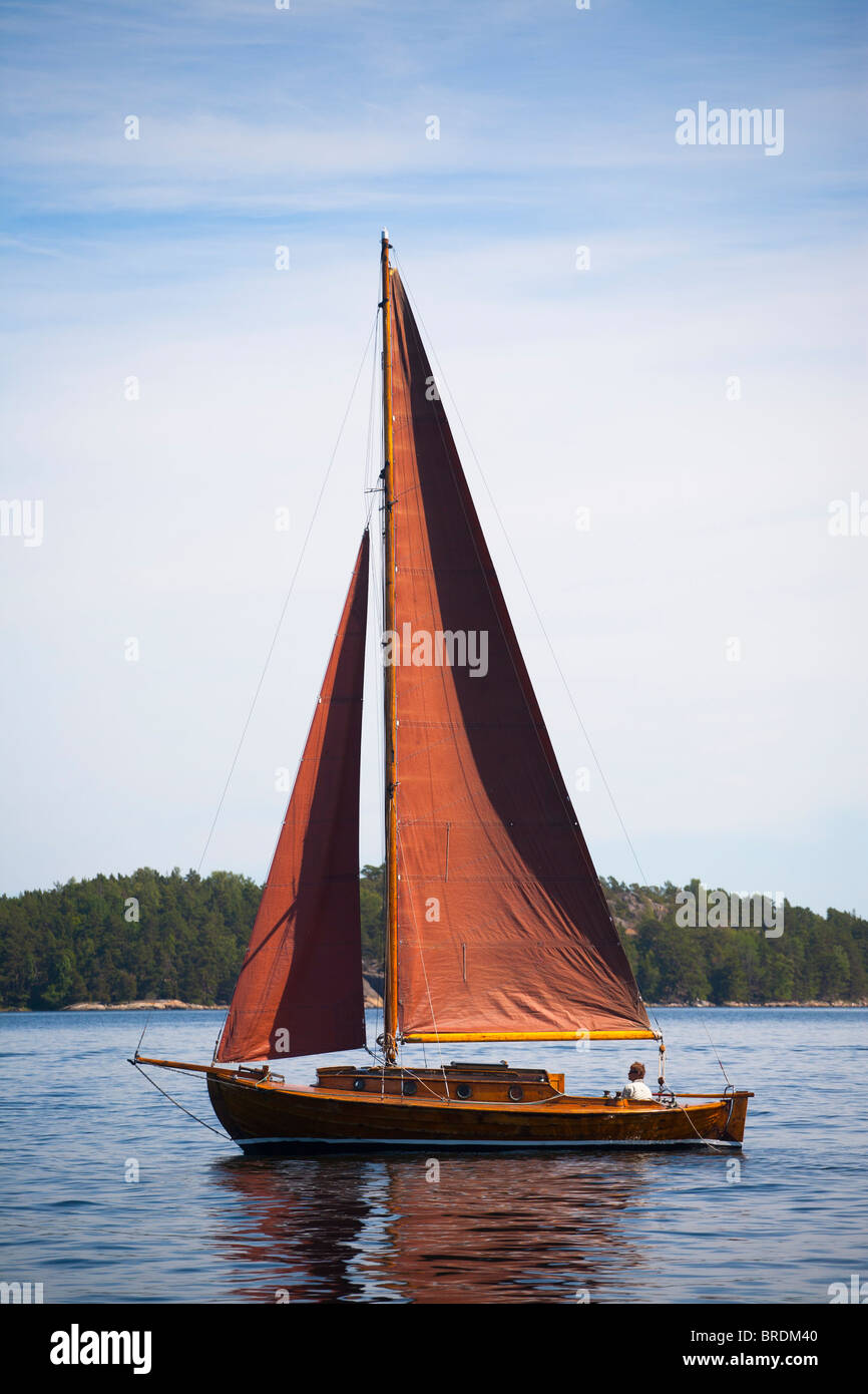 Old sail yacht with red sails in Swedish archipelago Stock Photo - Alamy