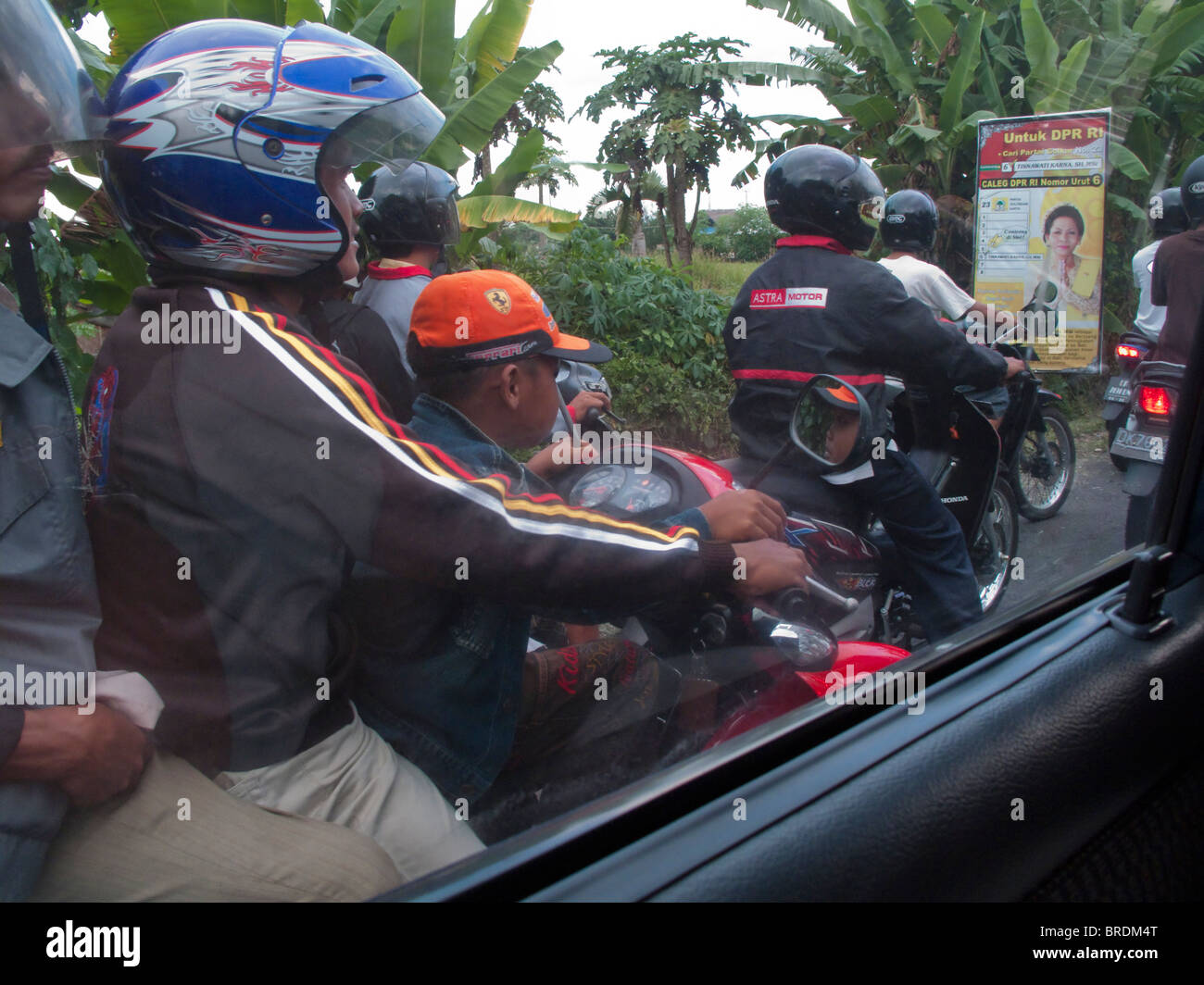 Bike drivers with children, Bali Indonesia Stock Photo - Alamy