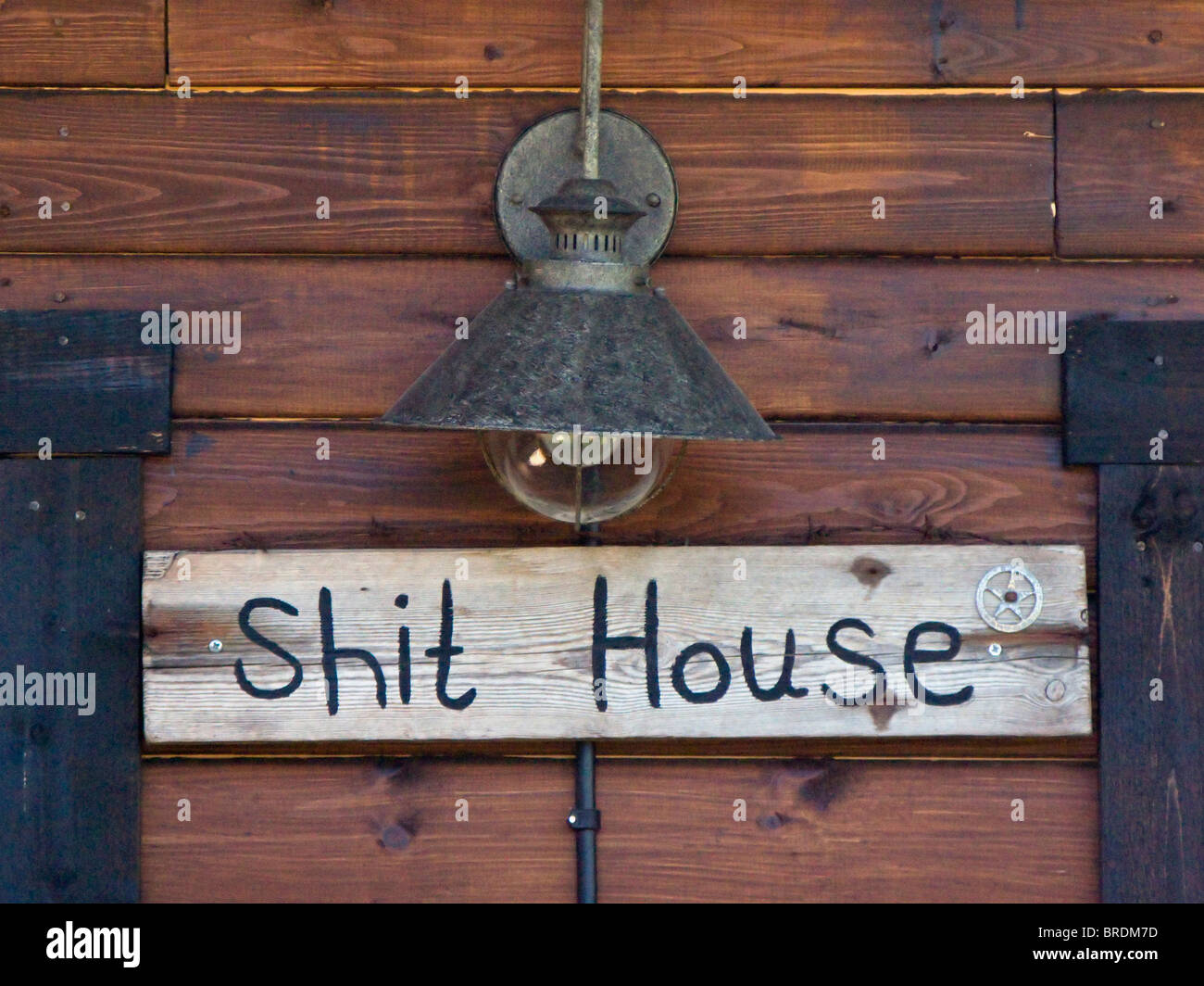 Shit House - sign on a public bathroom Stock Photo - Alamy