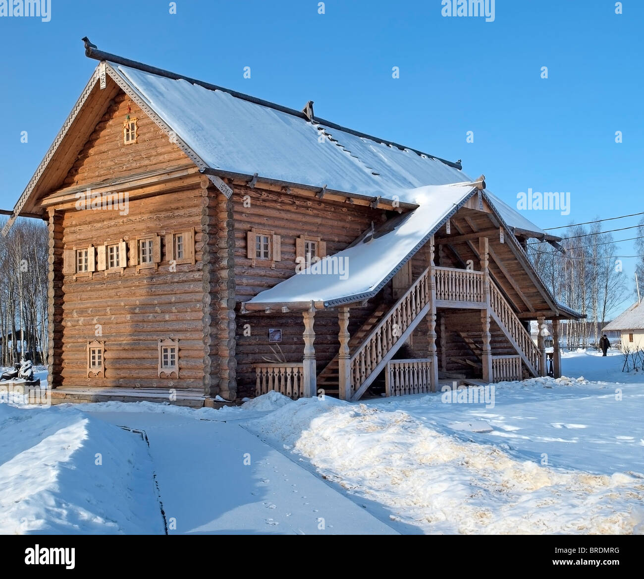 Log wooden house tradition Russia with staircase in winter with snow ...