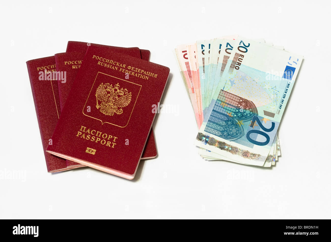Red Russian Passports And Euro Cash Small Banknotes Near On White