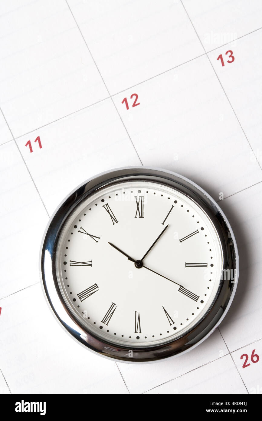 calendar and clock close up shot Stock Photo - Alamy
