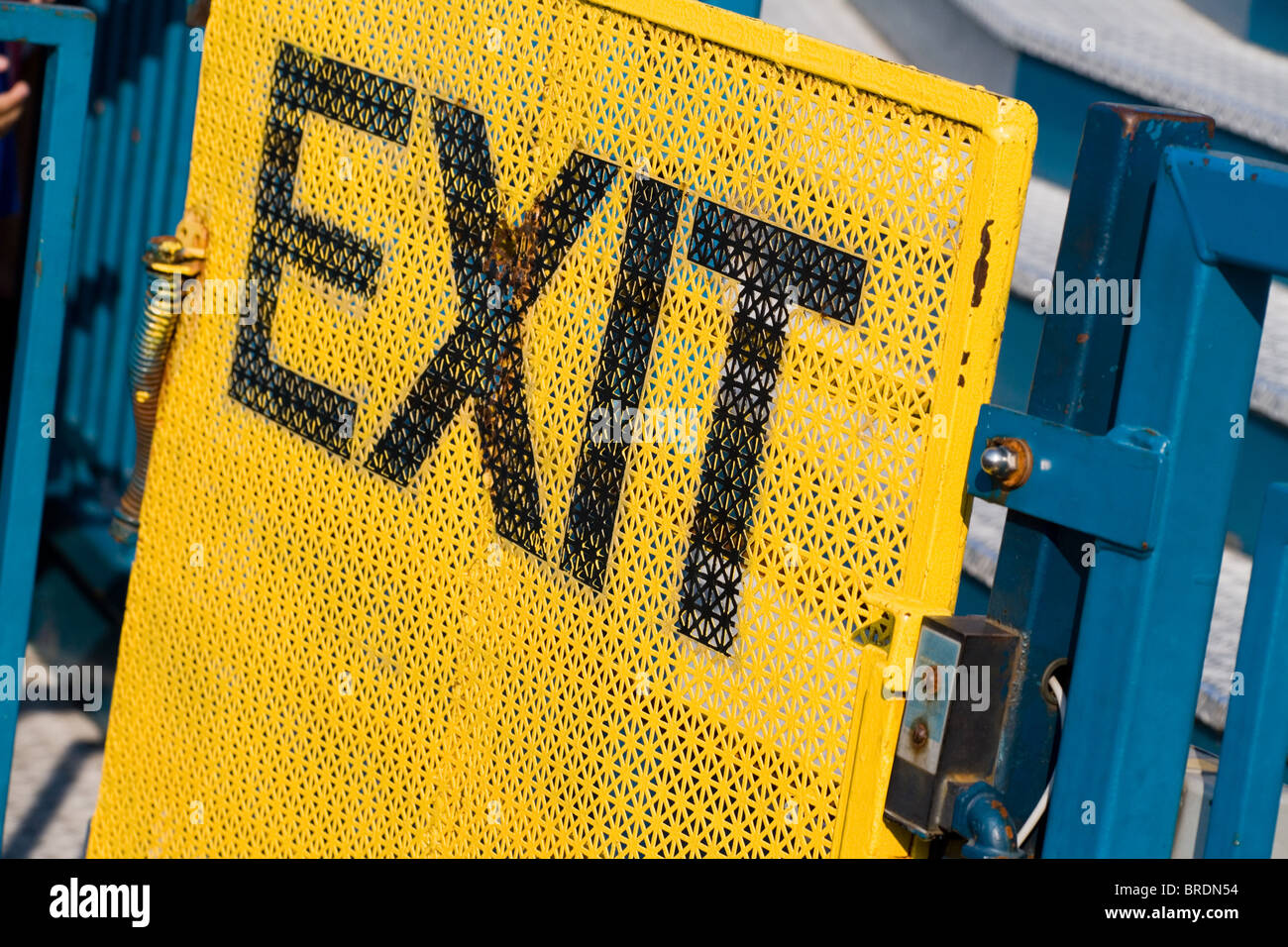Exit Sign with yellow background Stock Photo - Alamy