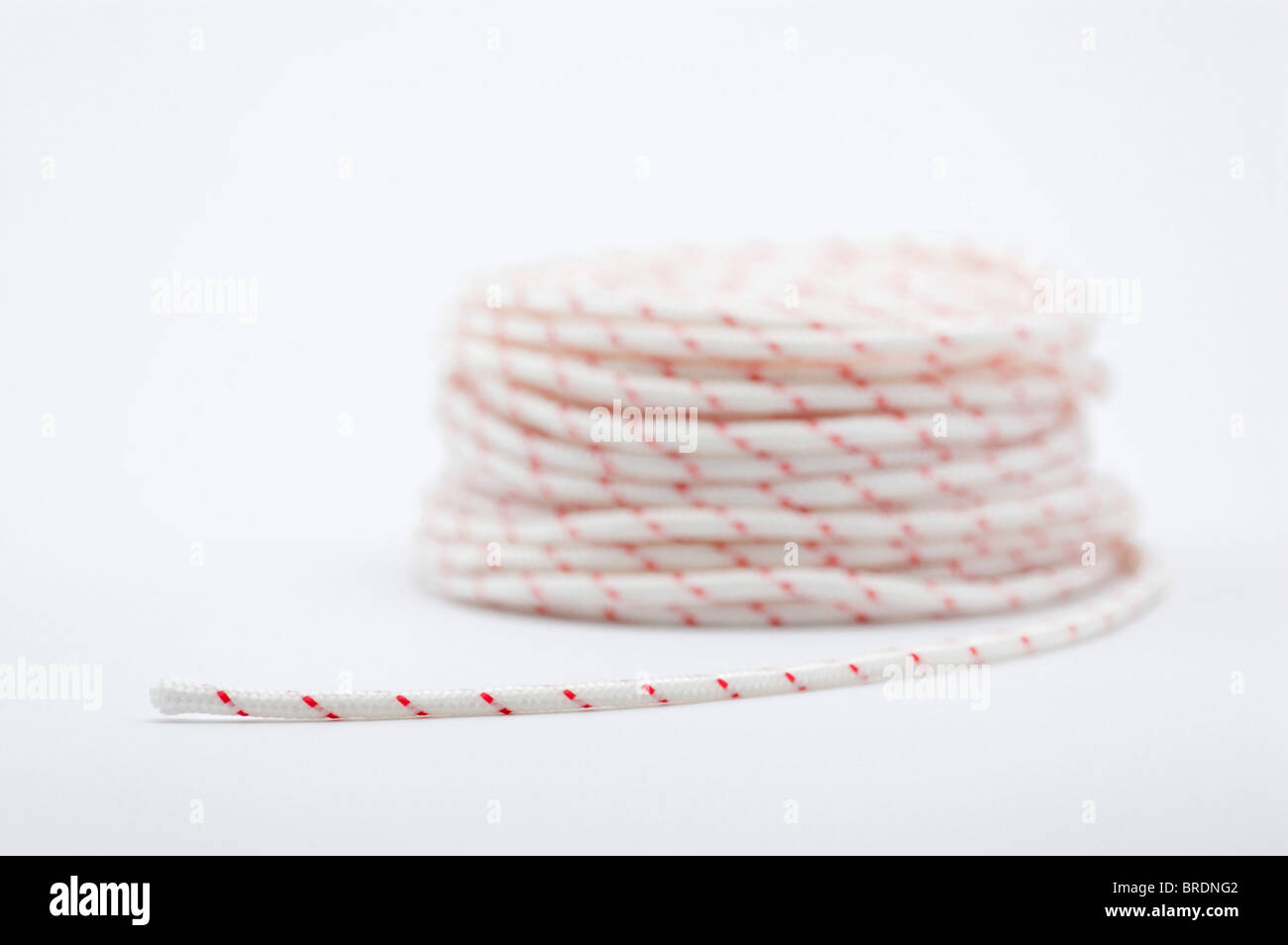 Bundle of white, nylon laundry rope Stock Photo - Alamy