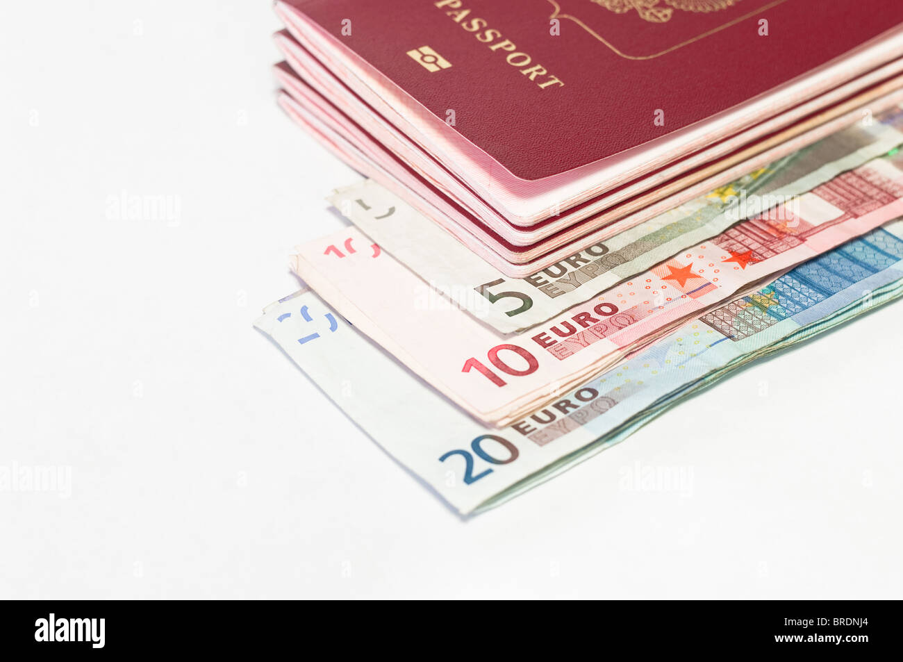 Red Russian Passports And Euro Cash Small Banknotes Near On White