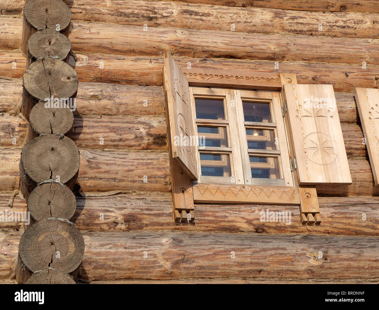 Part of the traditional Russian log house with window and shutters ...