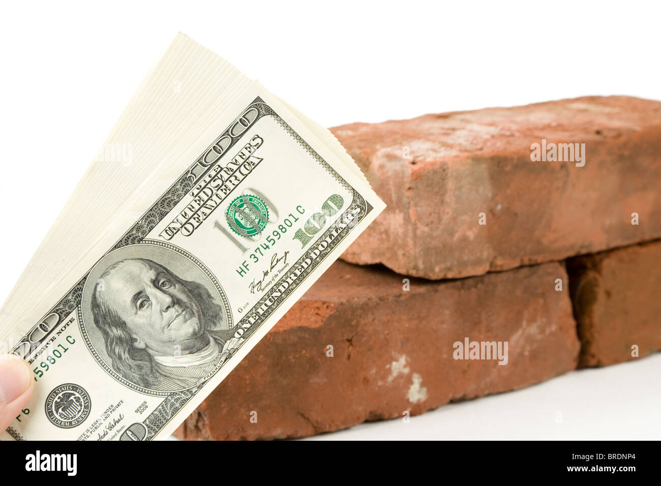 Red Brick and Dollar with white background Stock Photo - Alamy