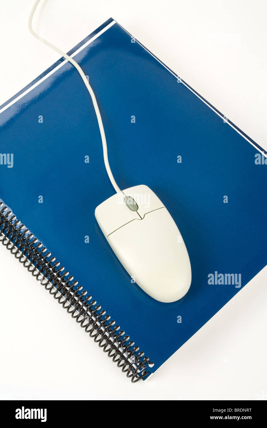 Blue school textbook and computer mouse, online learning Stock Photo ...