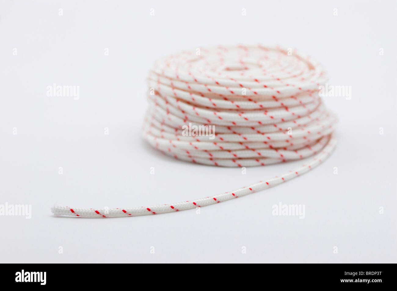 Bundle of white, nylon laundry rope Stock Photo - Alamy
