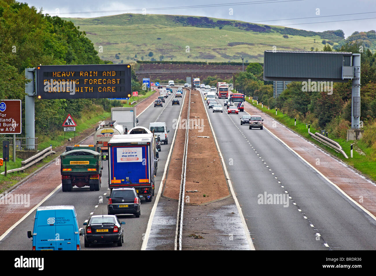 Busy motorway with gantry warning sign - M90 in Fife, Scotland near ...