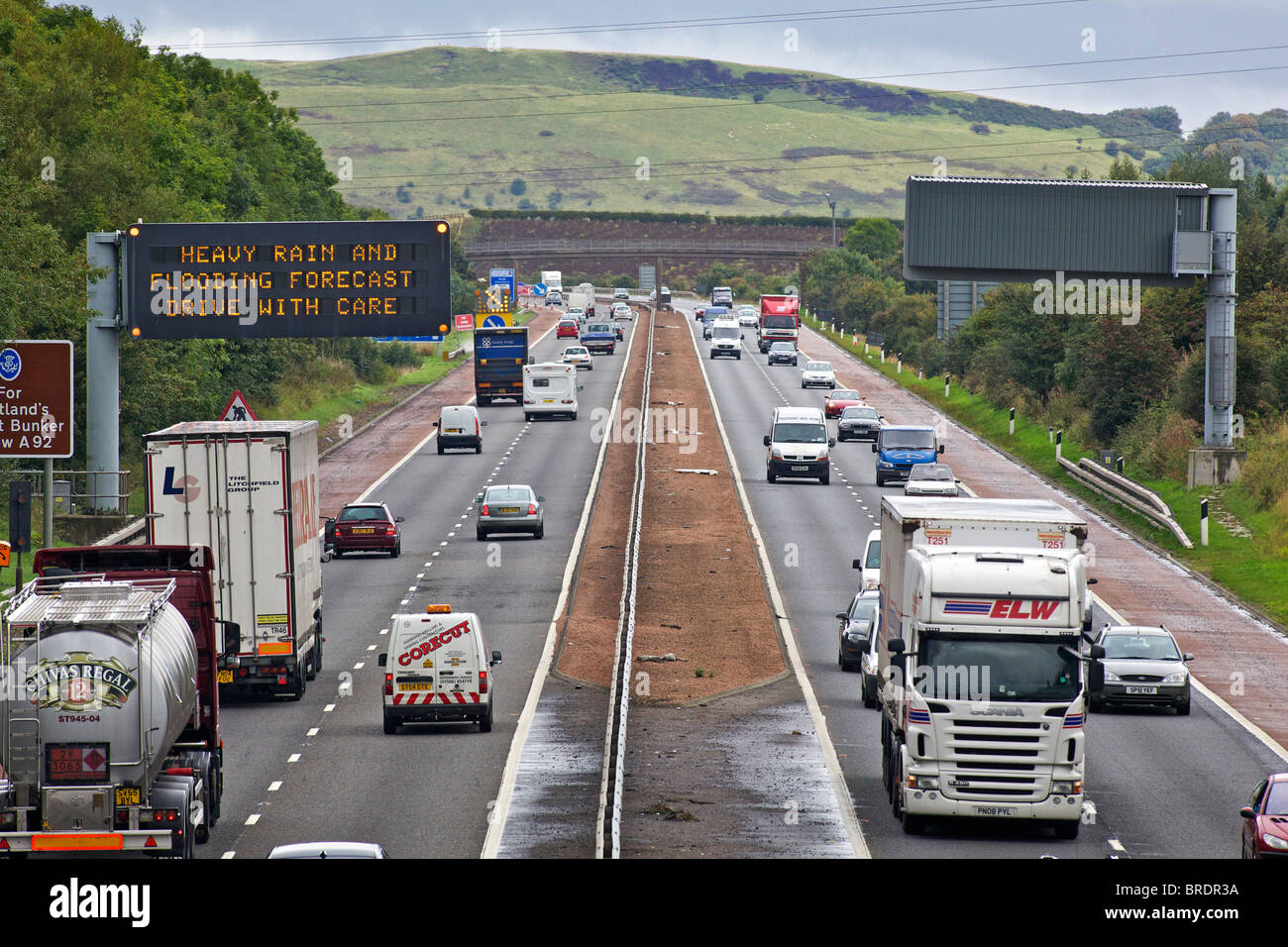 Busy motorway with gantry warning sign - M90 in Fife, Scotland near ...