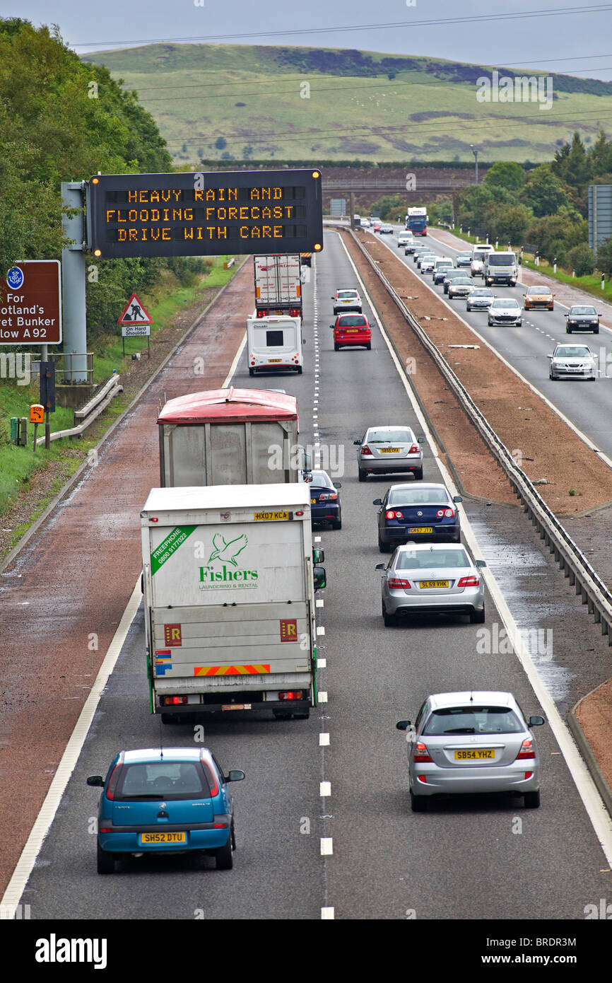 Busy motorway with gantry warning sign - M90 in Fife, Scotland near ...