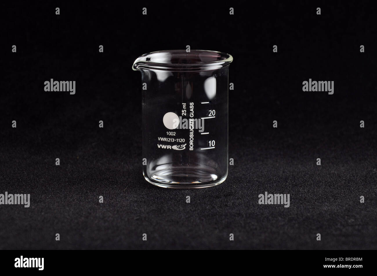 Clear glass measuring beaker 25ml Black seamless background . soft side ...