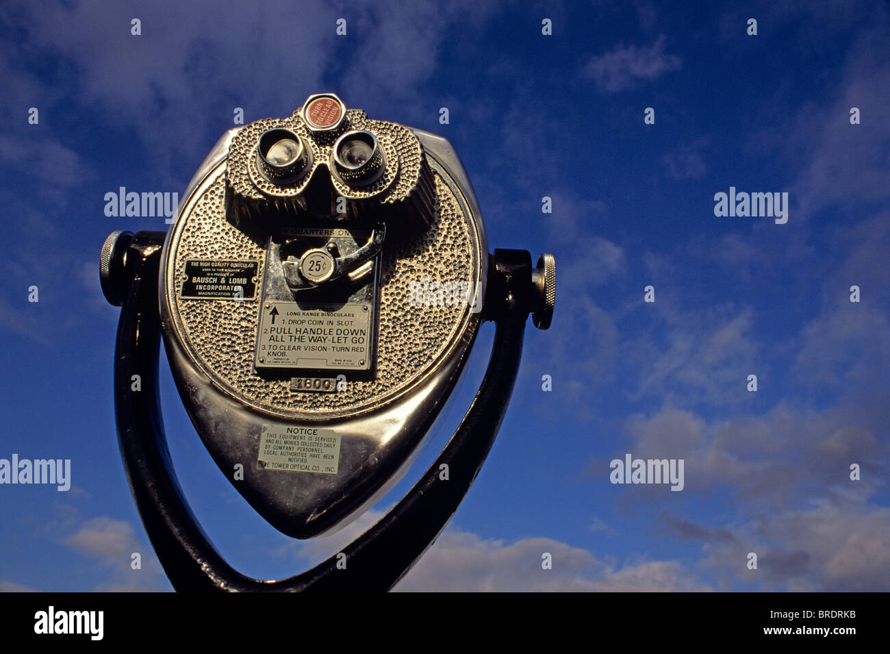 Coin operated binocular with clouds and blue sky Stock Photo - Alamy