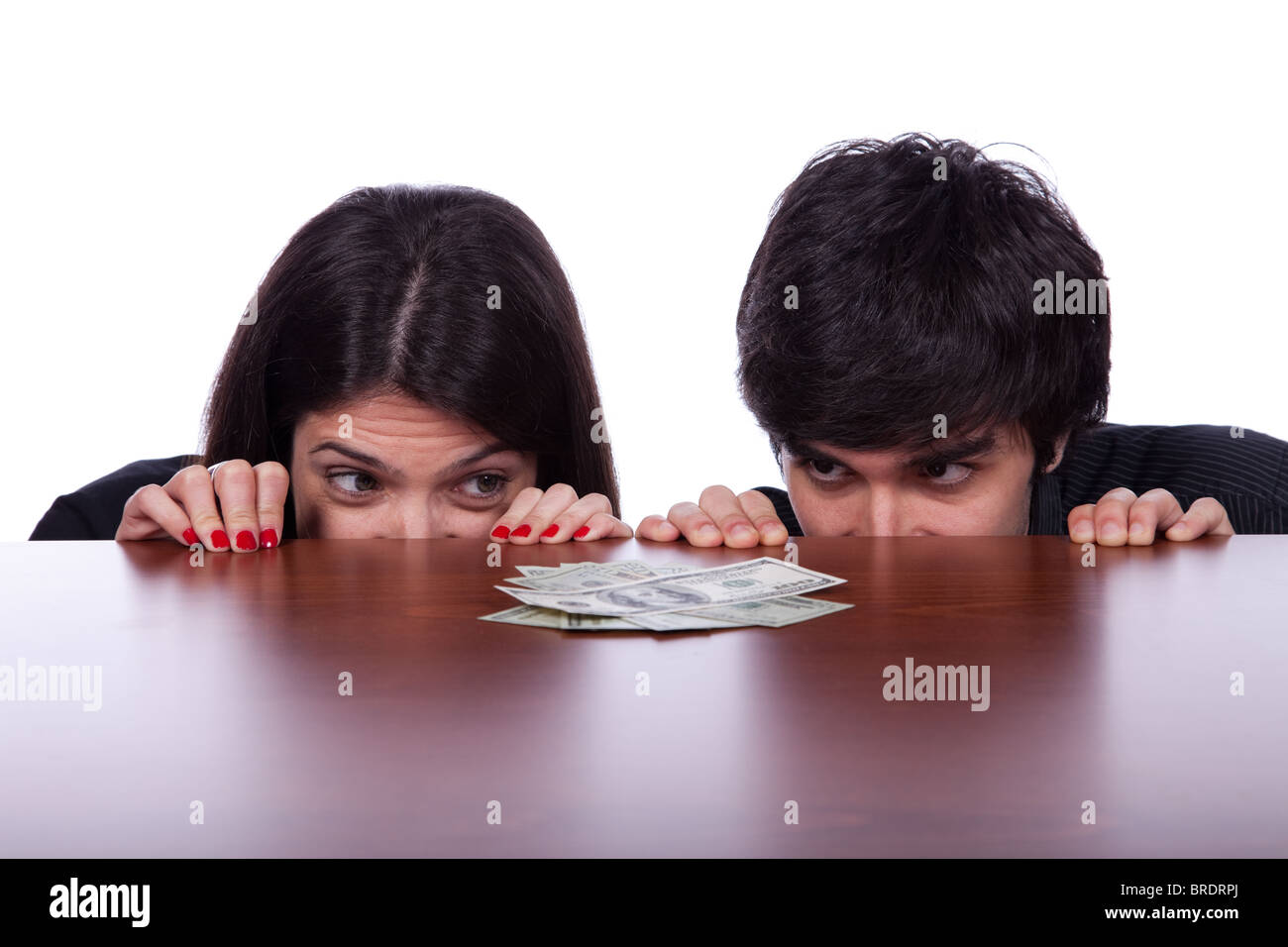 Men and woman looking to a lot of money over the table Stock Photo - Alamy