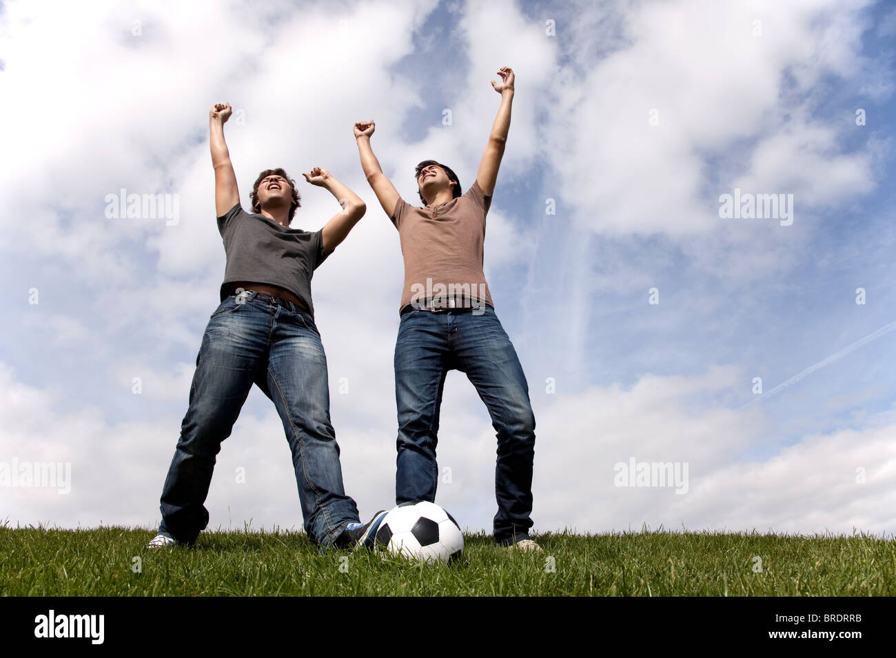 Two young men celebrating a goal from there soccer team Stock Photo - Alamy