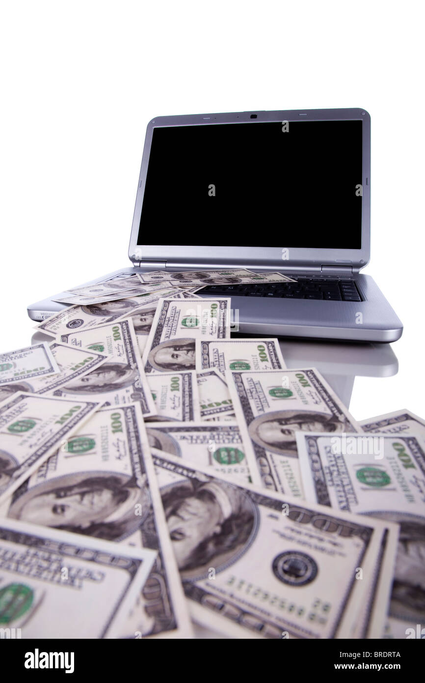Laptop with lots od money, spending or making money concept (with copy ...