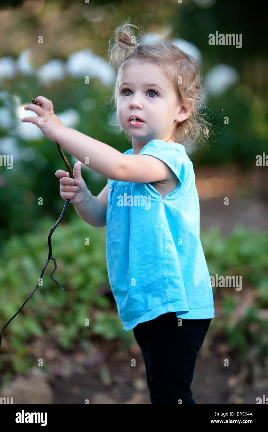 Toddler with stick hi-res stock photography and images - Alamy
