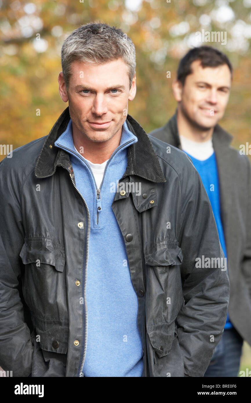 Two Men Standing Outside In Autumn Woodland Stock Photo - Alamy