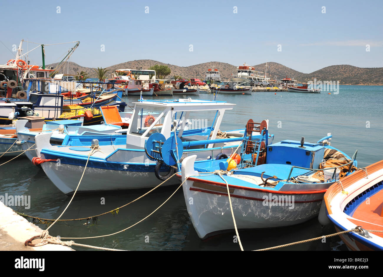 The busy fishing port and harbour in Elounda, Crete, Greece Stock Photo ...