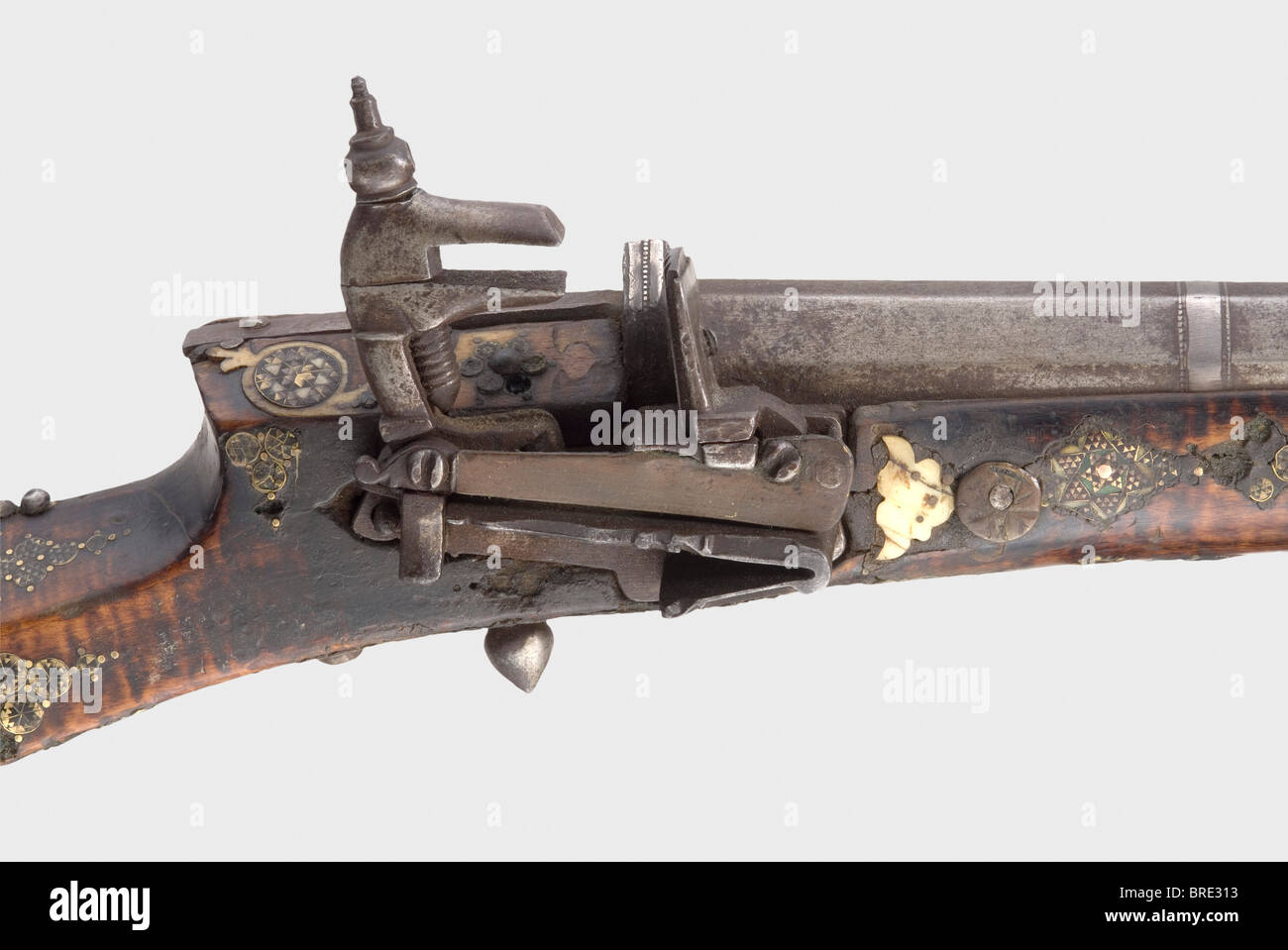 An Ottoman miquelet lock rifle, 18th century Octagonal barrel with ...