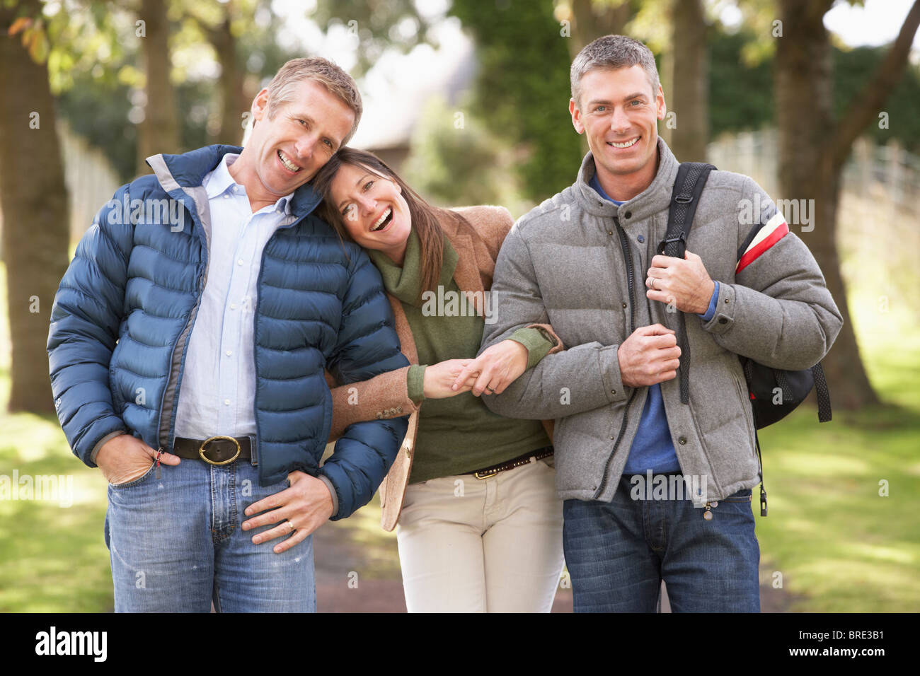 Group Of Friends On Walk In Autumn Park Together Stock Photo - Alamy