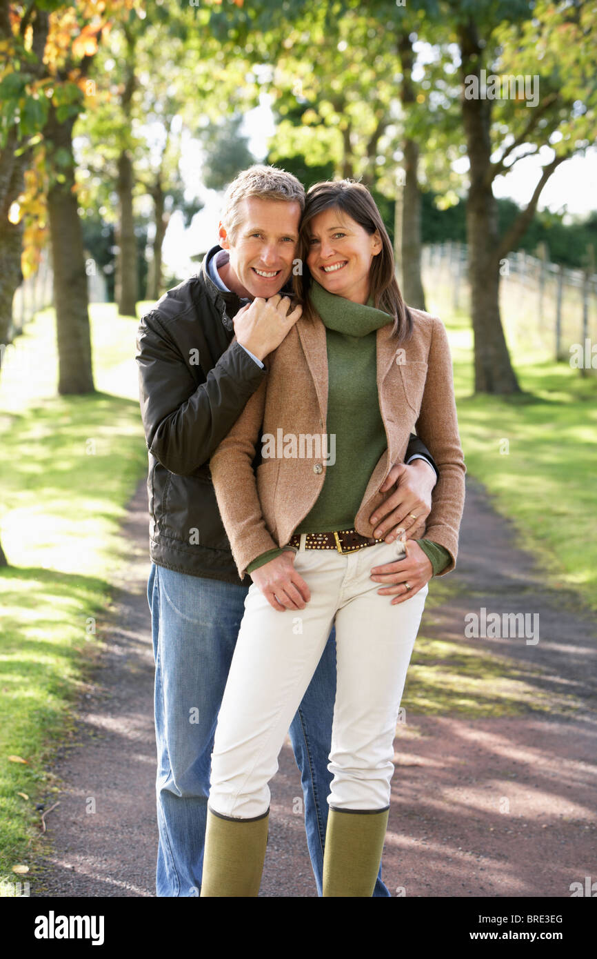 Portrait Of Romantic Couple Enjoying Outdoor Walk Through Autumn Park ...